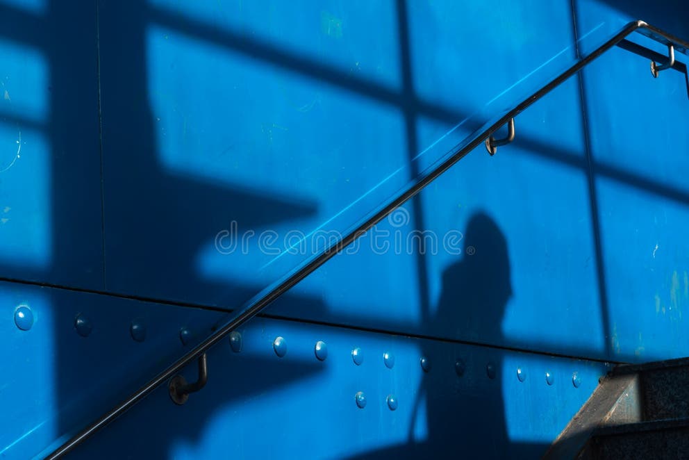 The Shadow of a Man on a Blue Surface Stock Photo - Image of lifestyle ...