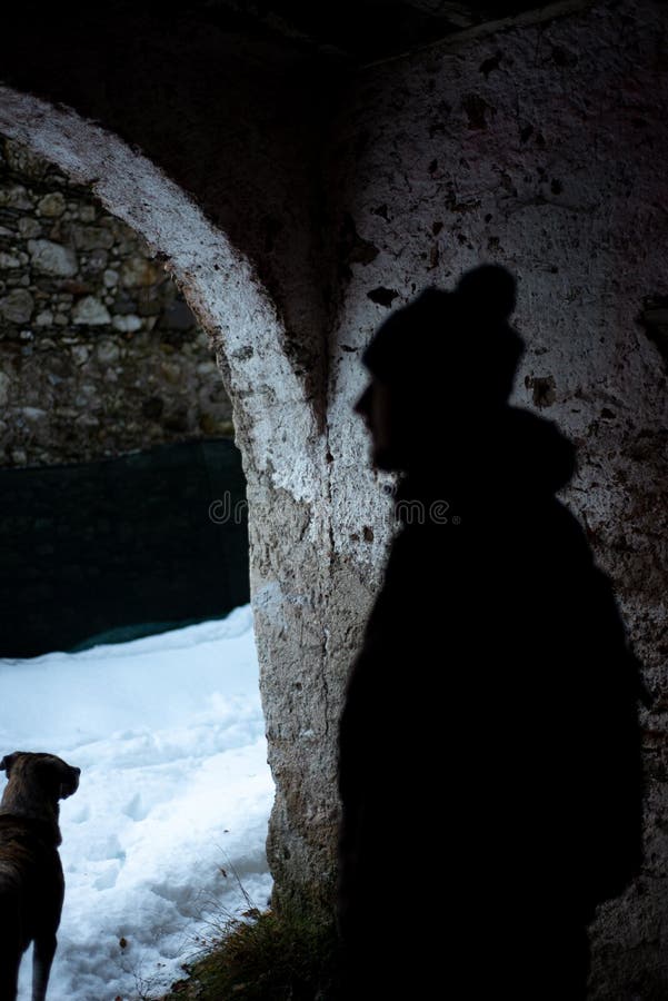 Shadow of Man with Dog Against Walls and Snow Stock Image - Image of ...