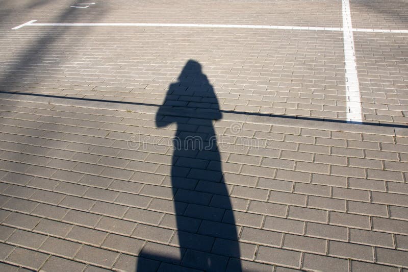 Shadow of a Man on the Gray Asphalt Stock Photo - Image of street ...