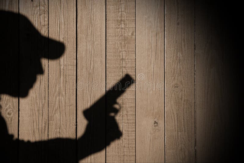 Shadow of a man with a gun stock image. Image of shadows - 38459881