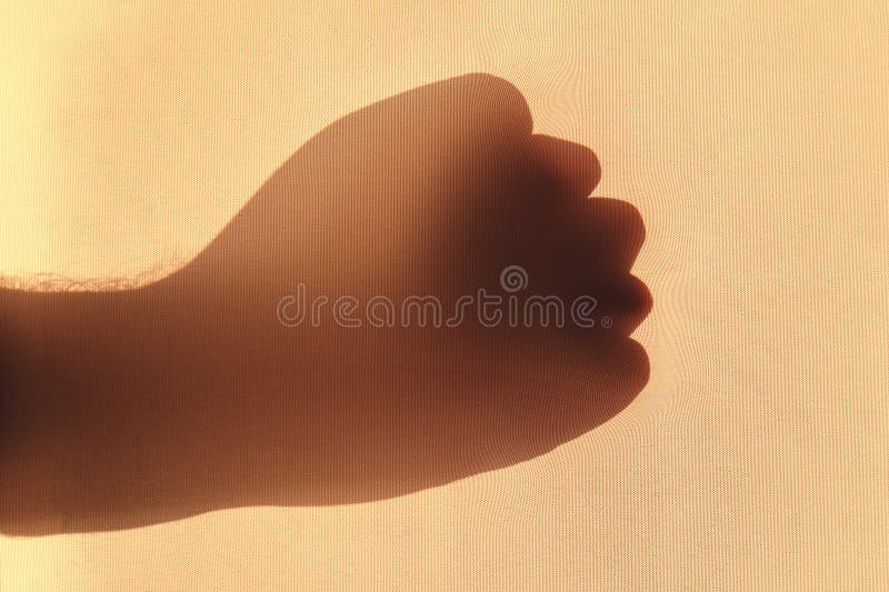 Shadow of a Man Hand Shows a Fist Gesture, Silhouette Stock Photo ...