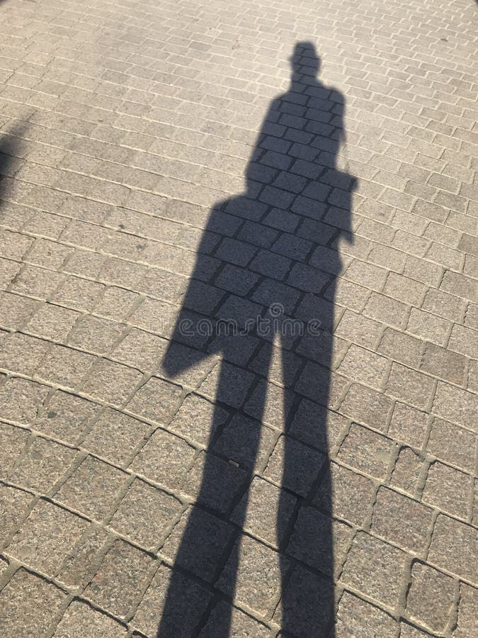 Shadow of the Man with Hat and Camera Stock Image - Image of shadow ...