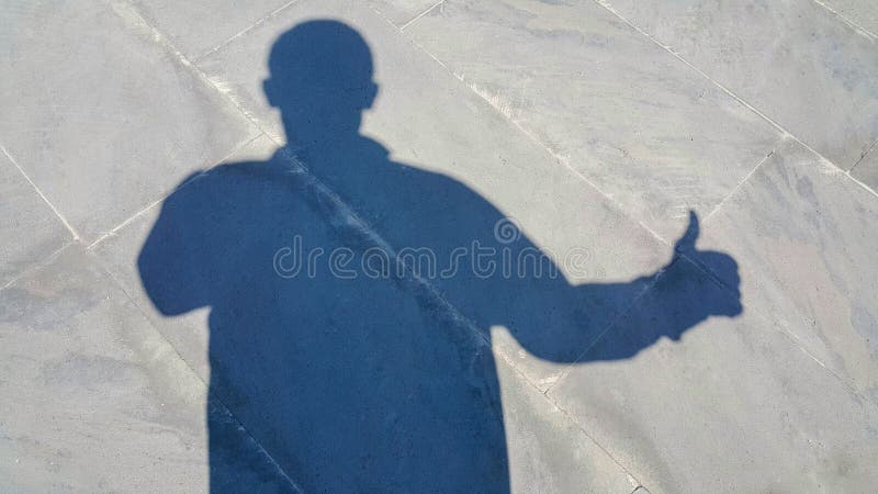 The Shadow of a Man Shows a Gesture Stock Image - Image of approval ...