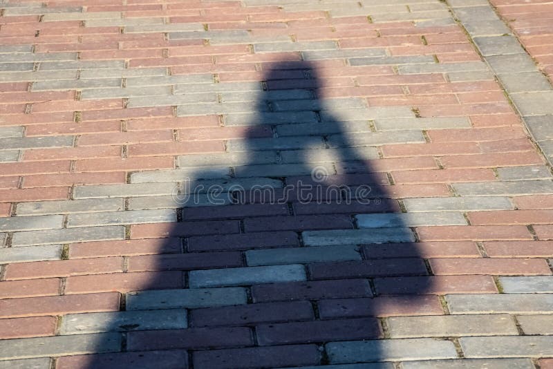 Shadow of a Man on the Sidewalk of Tiles Stock Image - Image of city ...