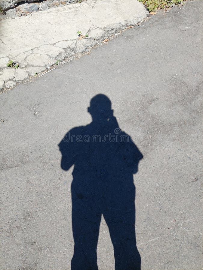 Shadow of a Man Standing on Asphalt Stock Image - Image of lane, iron ...