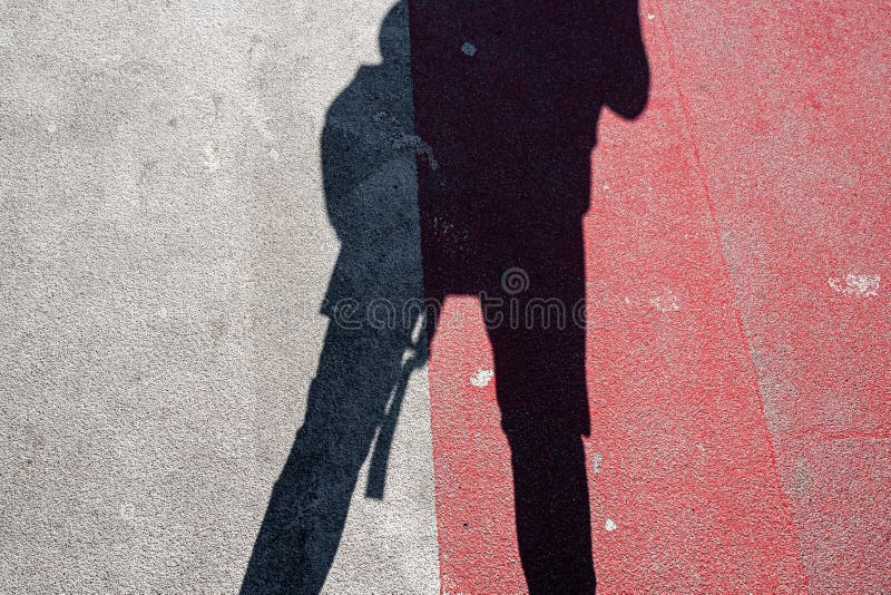 The Shadow of a Man Standing on the Pavement Stock Image - Image of ...