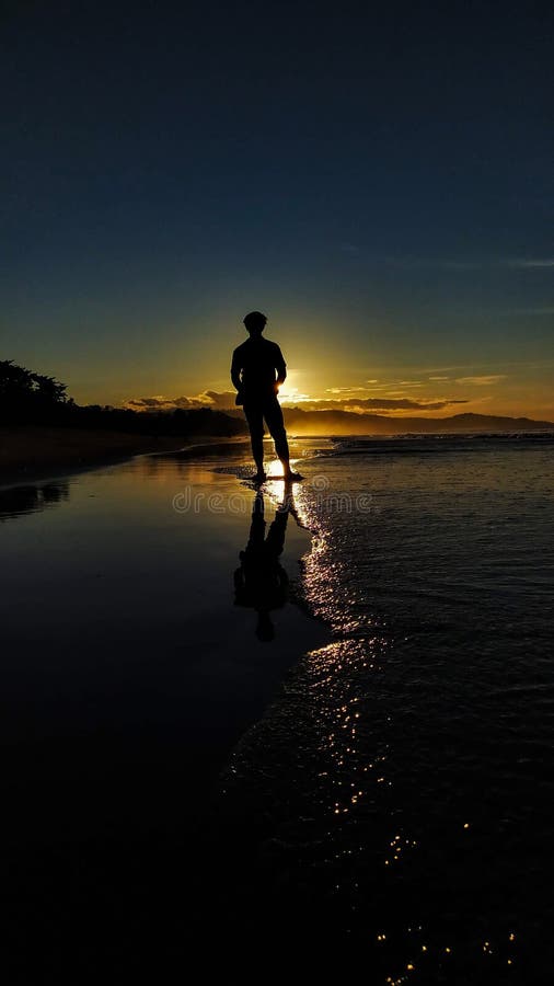 Shadow of a Man at Sunset on the Beach of Papua Stock Photo - Image of ...