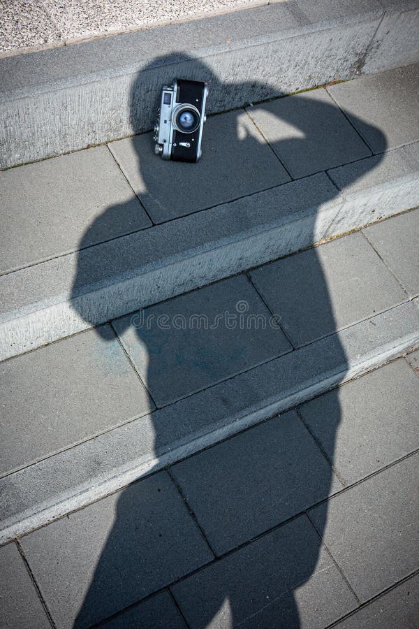 A Shadow of a Man Taking a Picture with a Camera Stock Photo - Image of ...