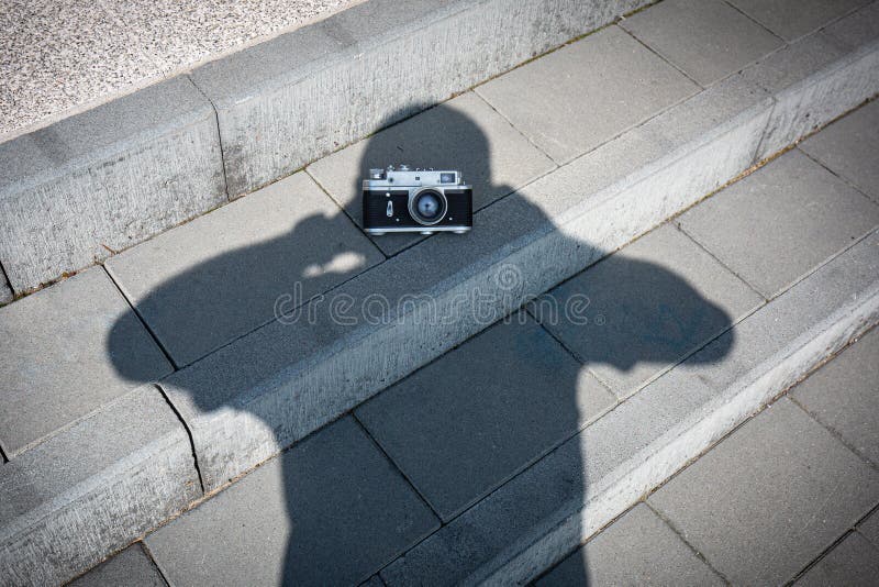 A Shadow of a Man Taking a Picture with a Camera Stock Photo - Image of ...