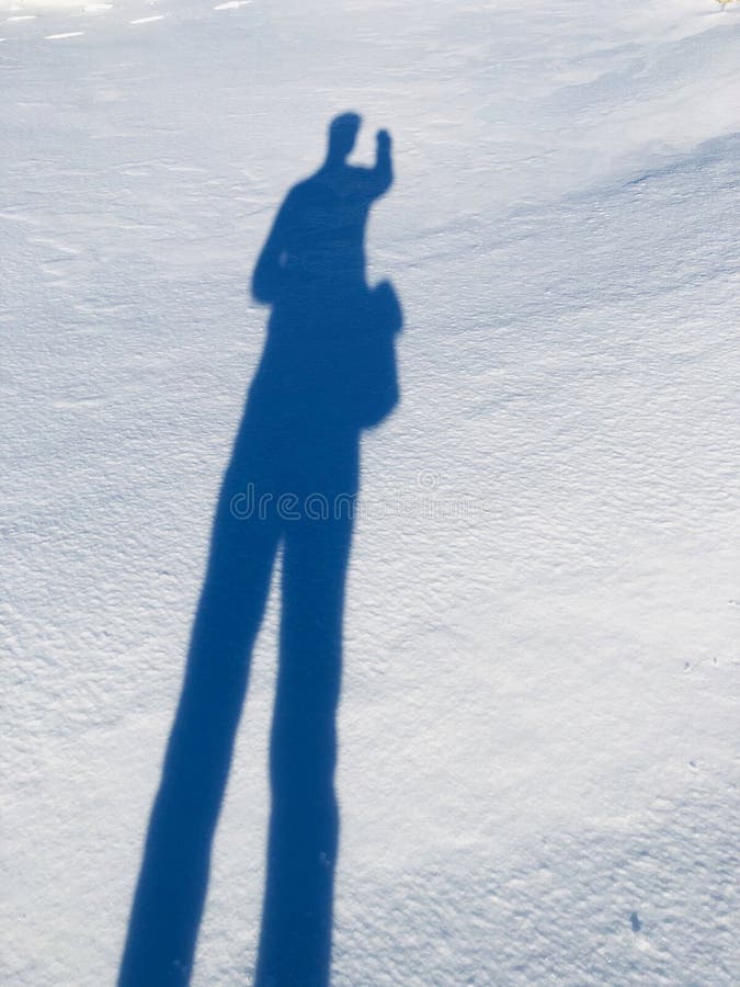 Shadow of a Man while Taking Selfie. Stock Image - Image of snow ...