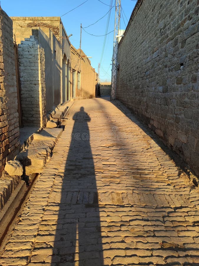 Shadow of a Man at Time of Sunset Stock Photo - Image of rock, alley ...