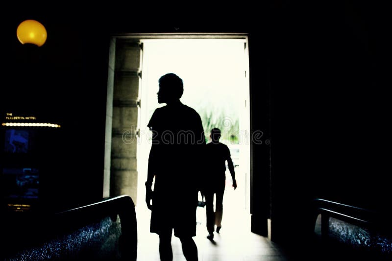 Shadow of a Man Walking through a Bright Door Stock Image - Image of ...