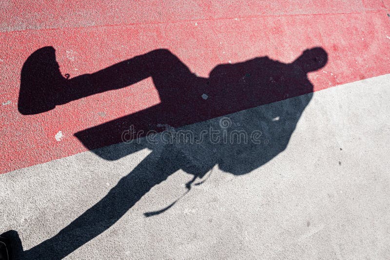 The Shadow of a Man Walking on the Pavement Stock Image - Image of warm ...