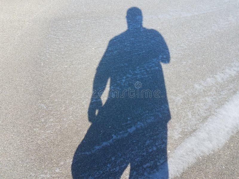 Shadow of Man on Wet Sand at Beach with Water Stock Photo - Image of ...