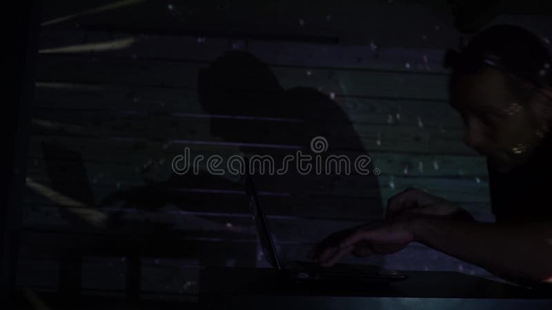 The Shadow of a Man Working at a Computer with Fireworks Stock Video ...