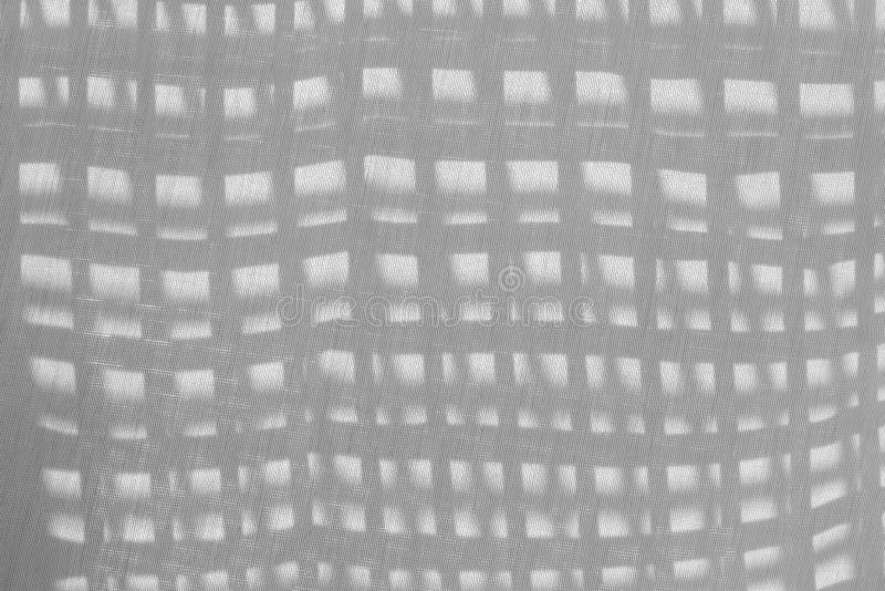 Shadow of mesh on fabric stock image. Image of square - 158017473
