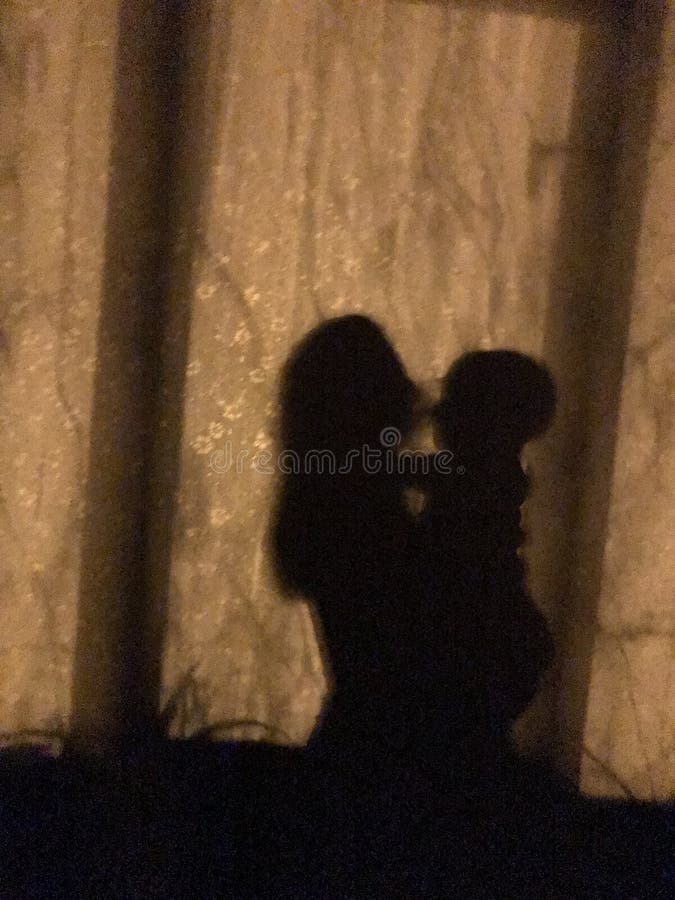 Shadow of mother and child stock photo. Image of shadow - 182447802