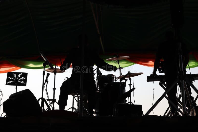 Shadow Musicians are Drumming on Stage. Stock Image - Image of shadow ...