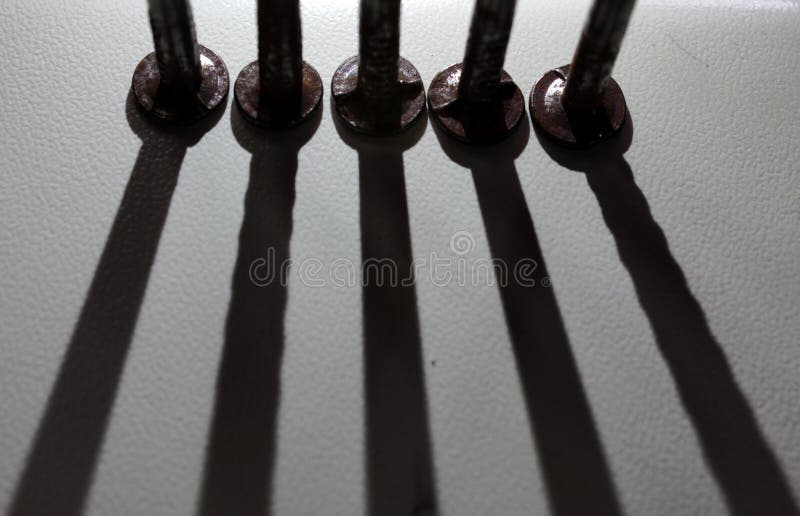 The Shadow from the Nails on the Orange Wall. Stock Photo - Image of ...