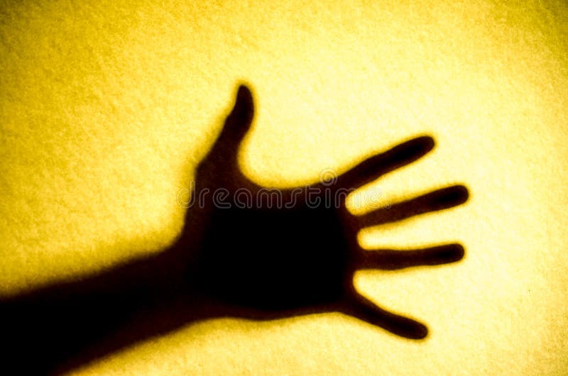 Shadow Hands of the Man on Yellow Back Stock Image - Image of nightmare ...