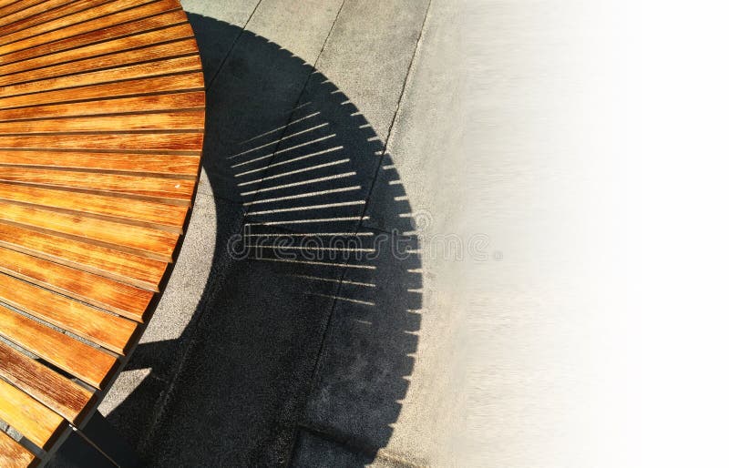 Shadow of Outdoor Curved Bench in Strong Light Stock Photo - Image of ...
