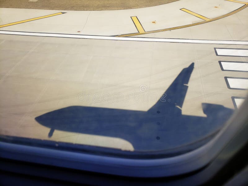 Shadow of a Passenger Jet Landing on a Runway Stock Photo - Image of ...