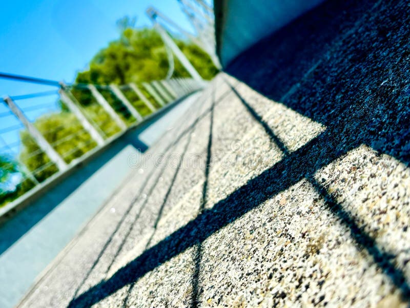 Shadow Patterns on a Bridge Walkway. Stock Photo - Image of concrete ...
