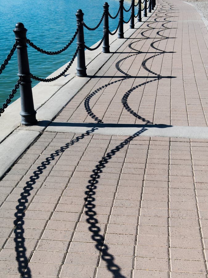 Sidewalk Shadow, Chain Barrier Stock Image - Image of alone, alley ...