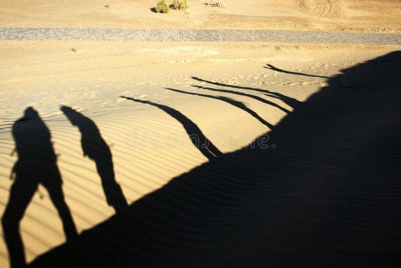 Shadow of people in desert stock photo. Image of desert - 16500024