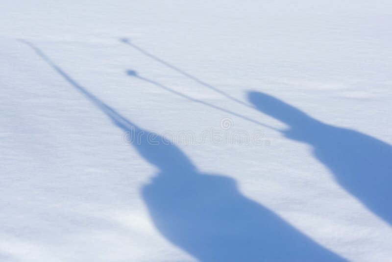 Shadow of People with Skis on the Snow. Stock Image - Image of ...