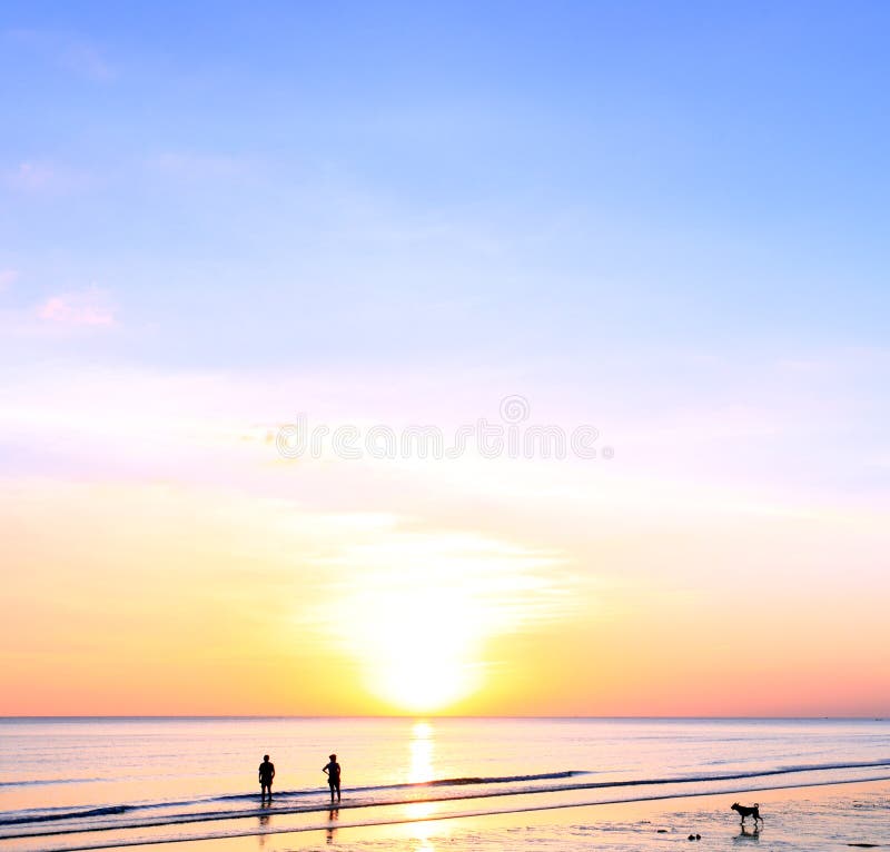 Shadow People at Sunset Along the Coast Stock Image - Image of couple ...