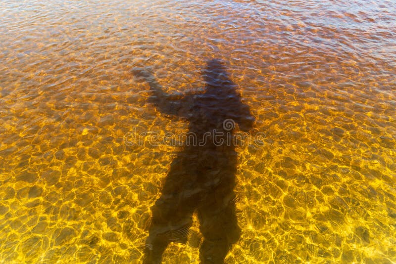 Shadow of a Person Dropping on the Guaibimzinho River Stock Photo ...