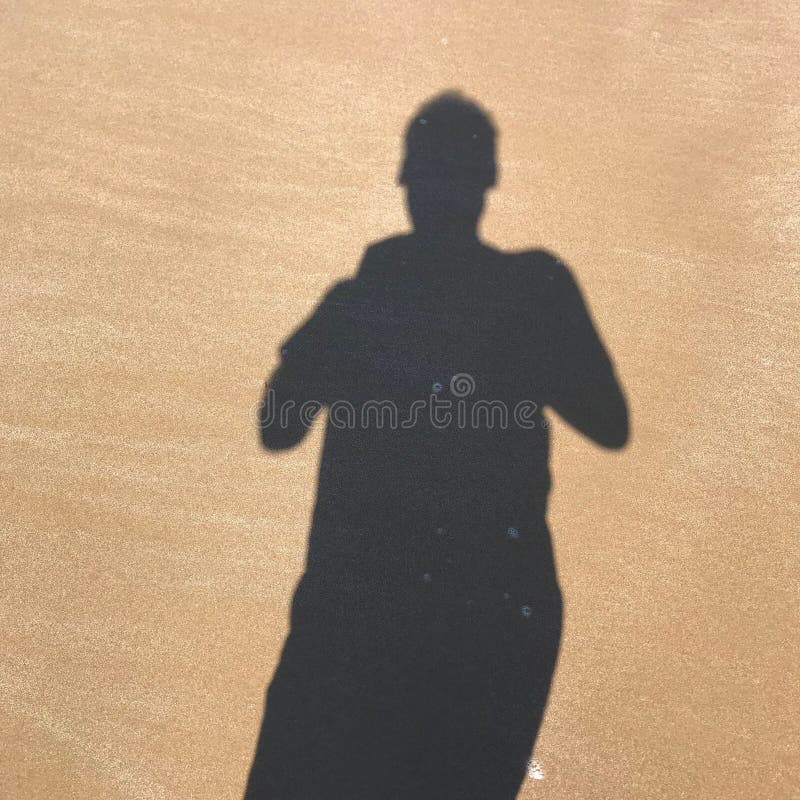 Shadow of a person in sand stock image. Image of abstract - 181782857