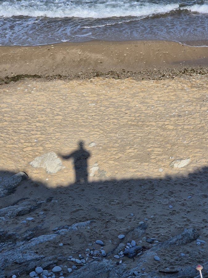 Shadow of a Person on a Sandy Beach by the Sea Stock Photo - Image of ...