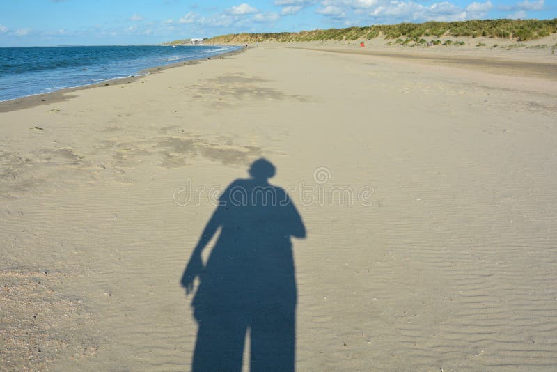 Shadow of a Person on the Sandy Beach by the Sea Stock Photo - Image of ...