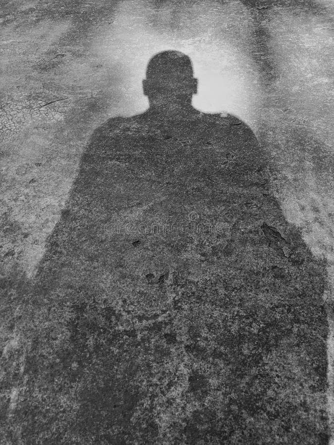 The Shadow of a Person Standing in the Hot Sun Has Black Shadows. Stock ...