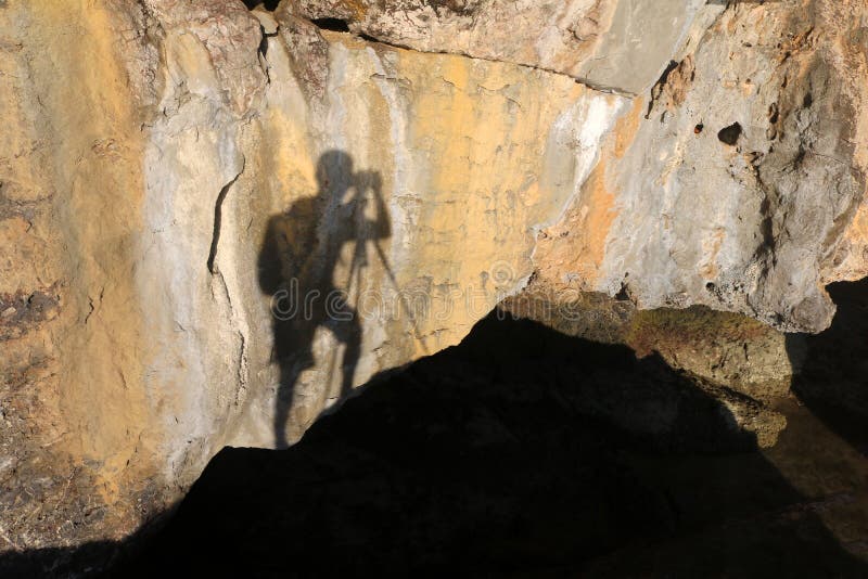 The Shadow of the Photographer on the Limestone Cave Wall Stock Photo ...