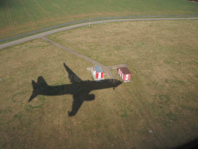 Shadow of the Plane in the Fields during the Landing Stock Photo ...