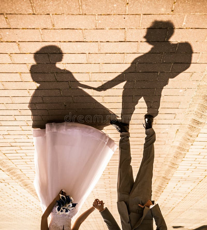 Shadow of Posing Wedding Couple on Ground Stock Photo - Image of posing ...