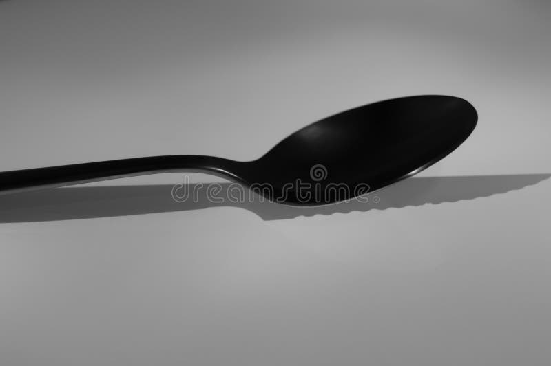 Spoon with a fork shadow stock image. Image of utensil - 42654511