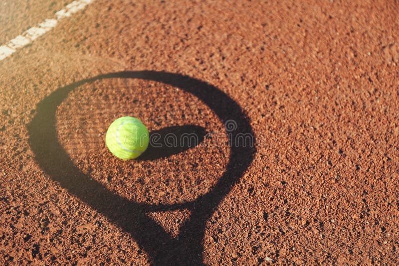 Shadow of Racket and Tennis Ball on Clay Court. Space for Text Stock ...