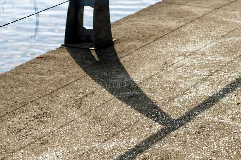 The Shadow of the Railing Near the River Stock Photo - Image of ...