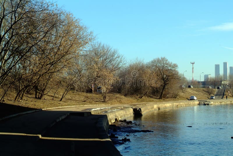 The Shadow of a Road Bridge on the River Stock Photo - Image of path ...
