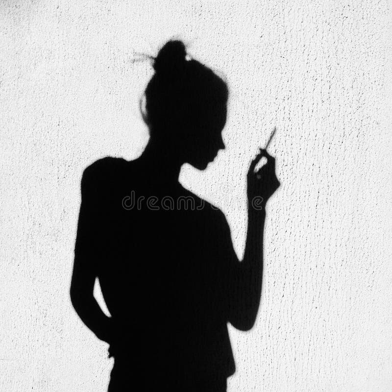 Shadow of Sad Girl Smoking Around on Wall Background Stock Photo ...