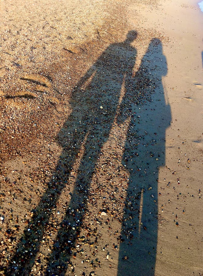 Shadow on the sand stock photo. Image of sand, love - 114504800