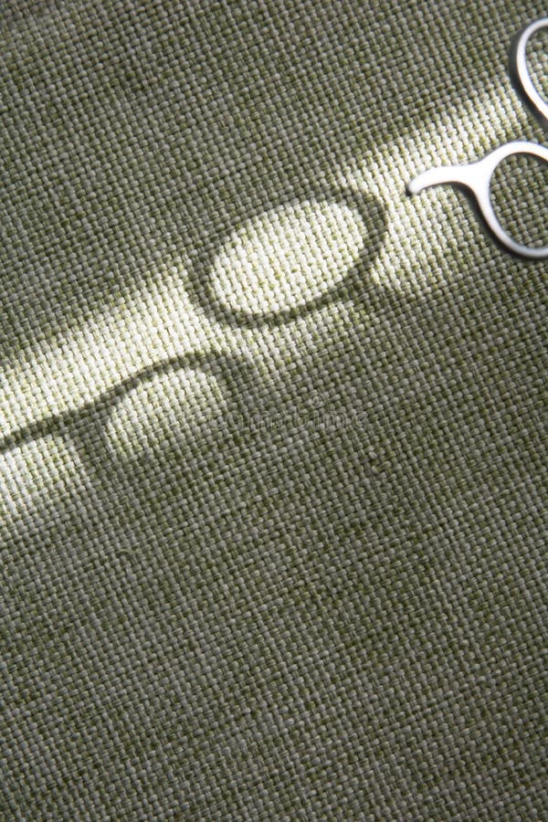 Shadow of Scissors on Green Fabric Stock Photo - Image of macro ...