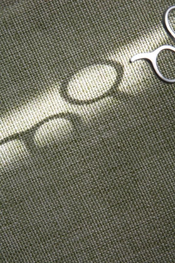 Shadow of Scissors on Green Fabric Stock Photo - Image of macro ...