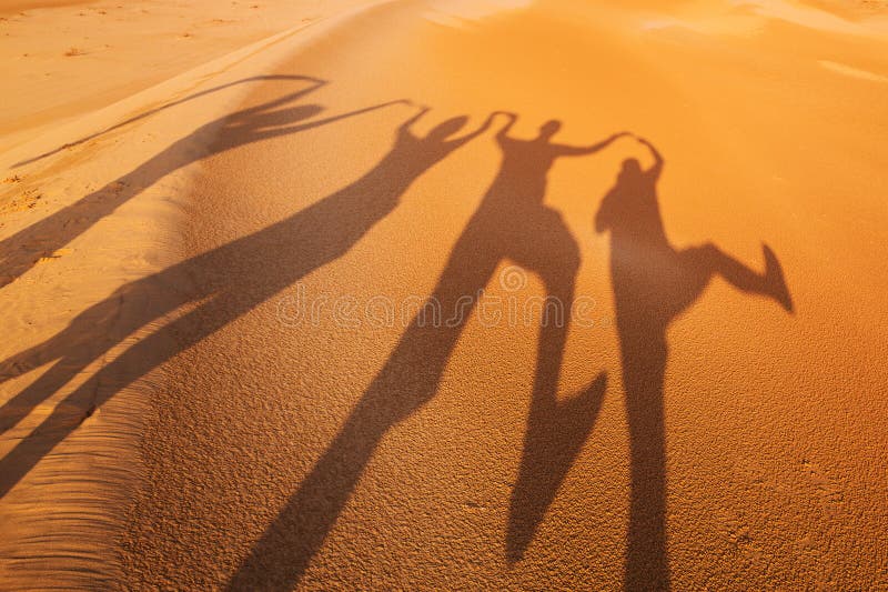 Shadow Silhouettes of Four People in the Desert Stock Image - Image of ...