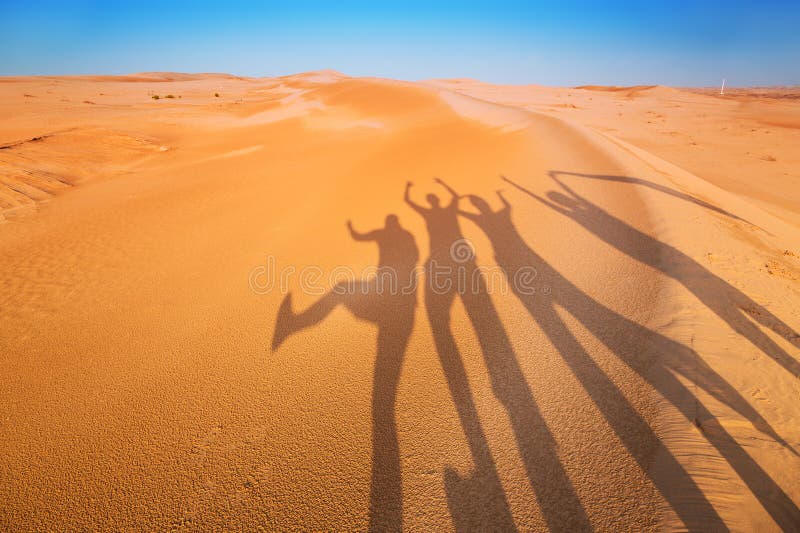 Shadow Silhouettes of Four People in the Desert Stock Photo - Image of ...