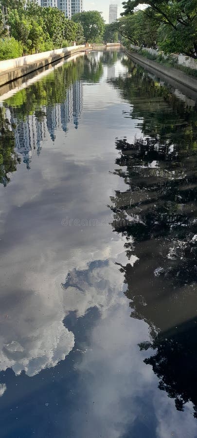 The Shadow of the Sky with the Black River Stock Image - Image of river ...